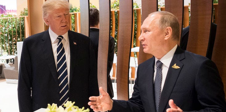 Trump & Putin’s Handshake Body Language Was All About “Power,” Expert Says
