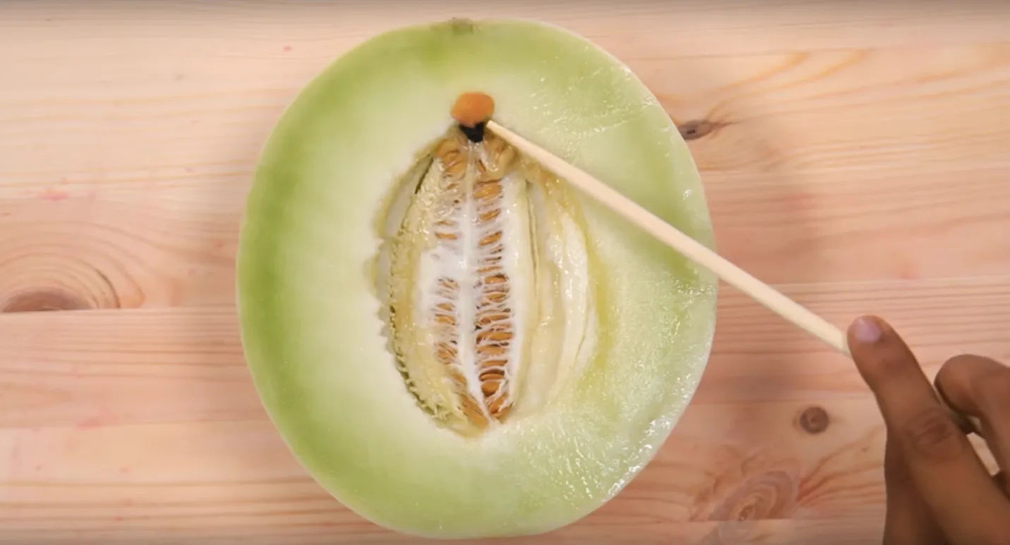 Men Practice Their Fingering Techniques On Fruit — VIDEO