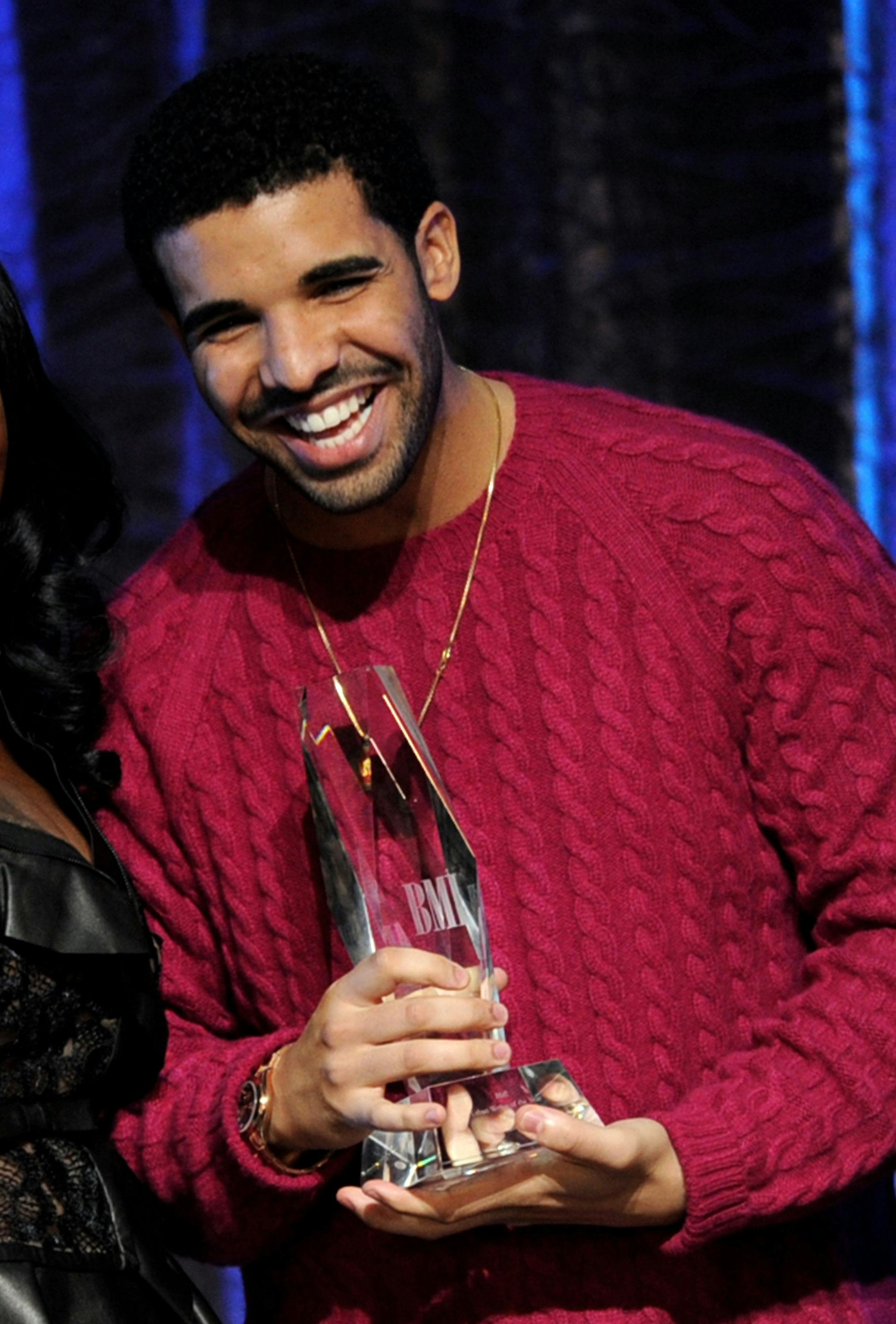 These 17 Photos of Drake Smiling Will Make Your Day